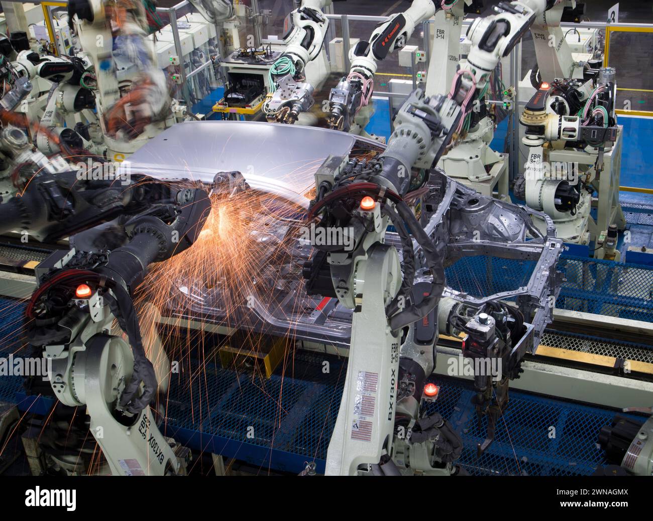 Sparks fly as robots weld Toyota Corolla bodyshells at Toyota's ...