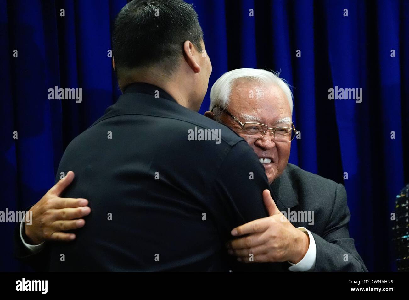 Chief Dominic H. Choi, is hugged by his father Joseph after he is sworn ...