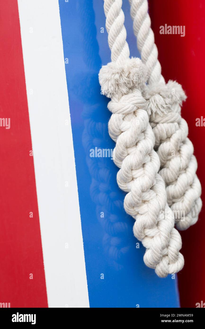 Rope and painted details in the union flag colours on a historic narrow ...
