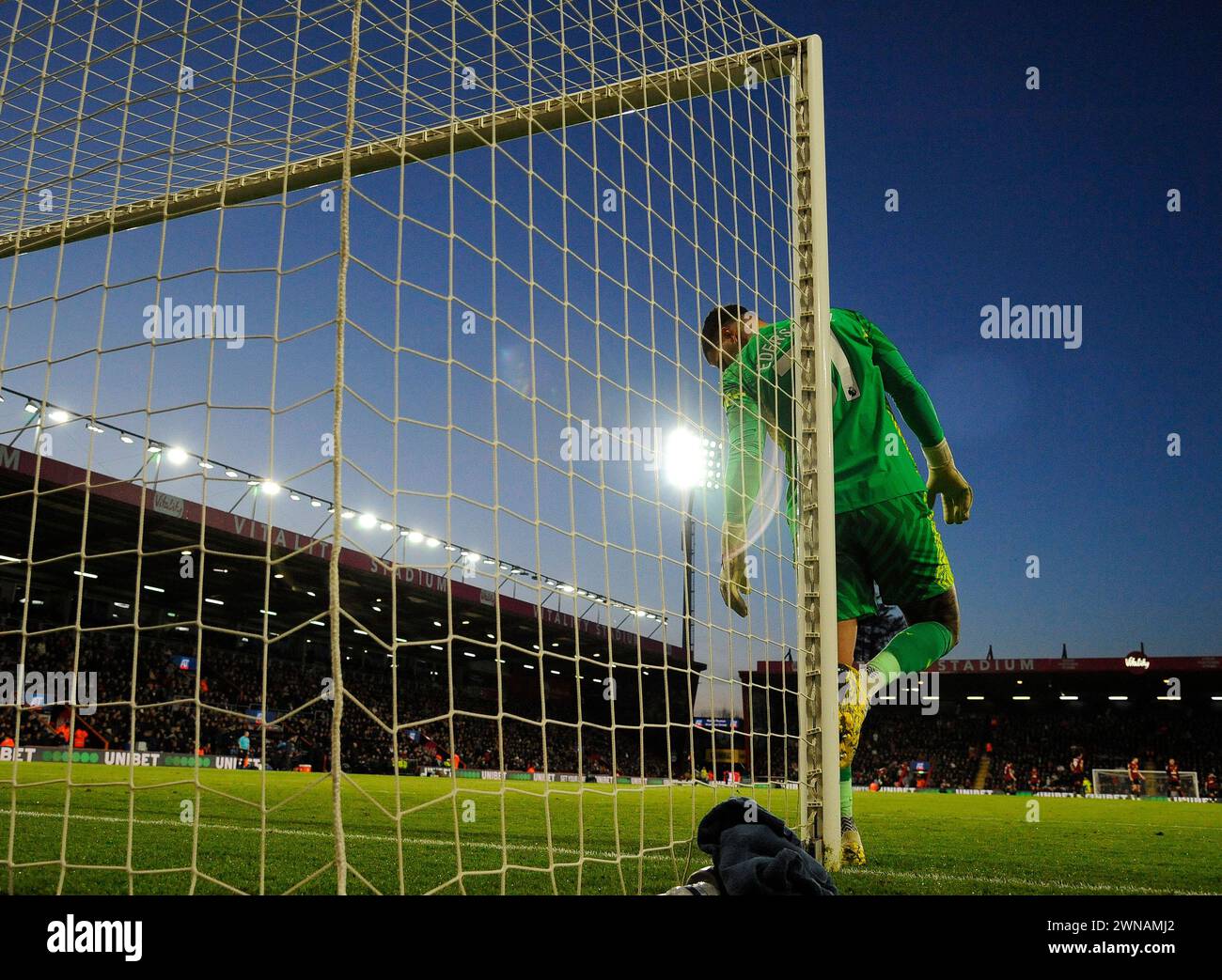 Ederson of Manchester City cleans his boots on the goal post - AFC ...