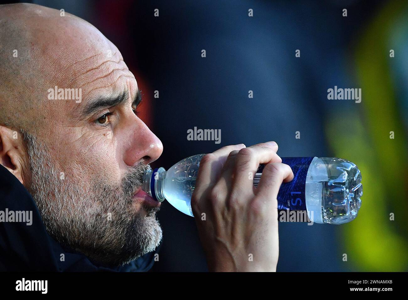 Manager of Manchester City Josep Pep Guardiola drinks from a bottle ...