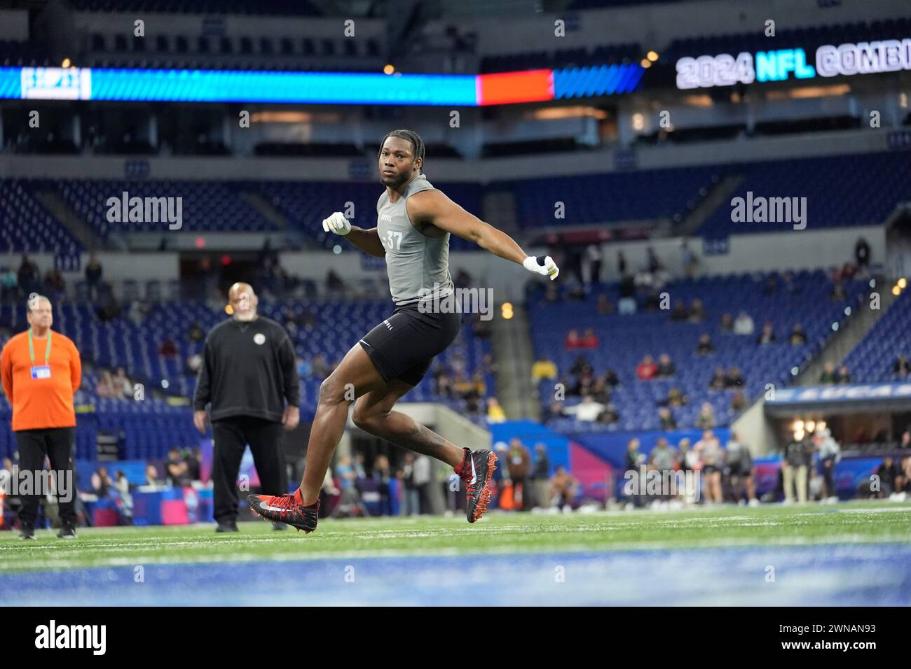 Notre Dame defensive lineman Javontae Jean-Baptiste runs a drill at the NFL football scouting ...
