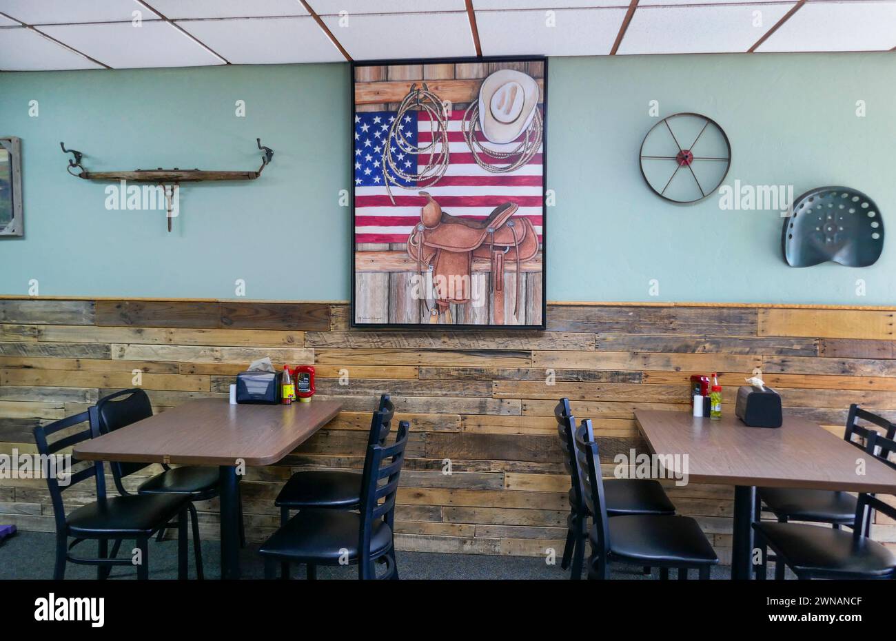 Cowboy painting and other Western decorations in a local restaurant in ...