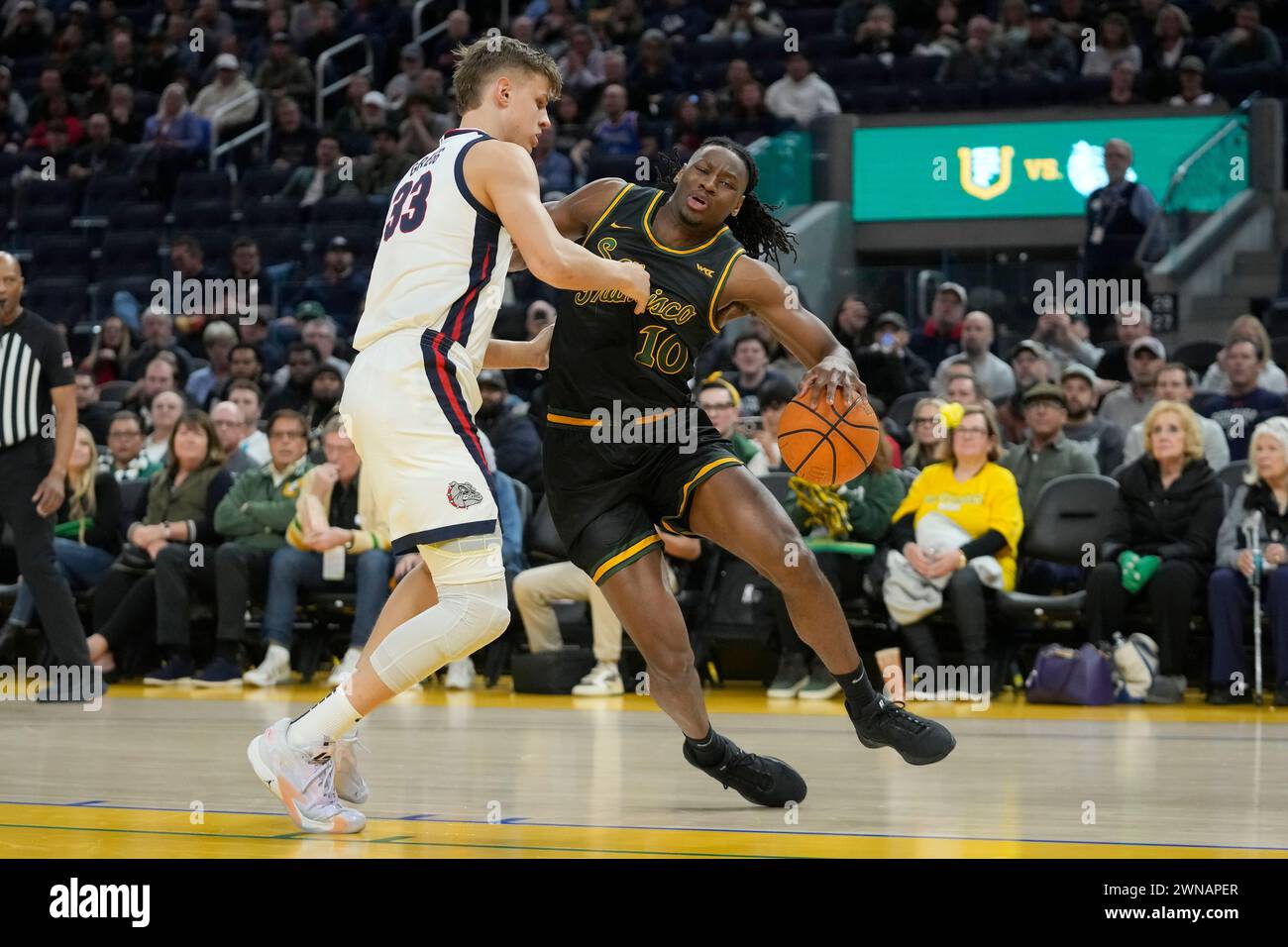 San Francisco forward Jonathan Mogbo (10) drives to the basket against ...