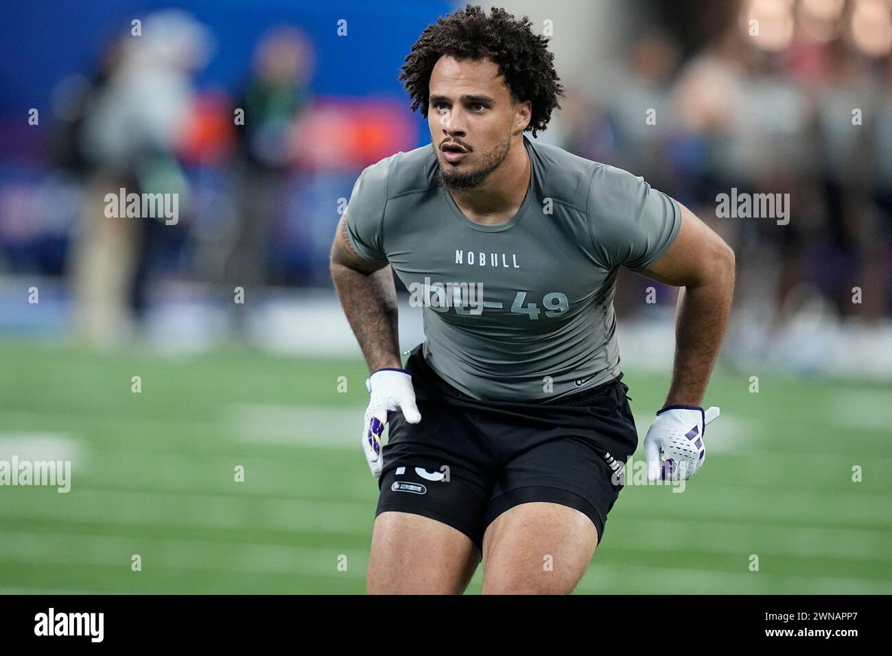 Washington defensive lineman Bralen Trice runs a drill at the NFL ...