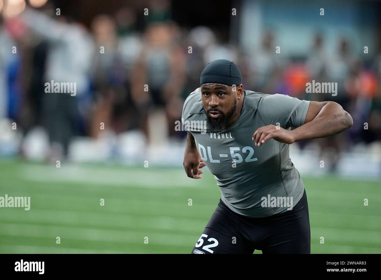 Connecticut defensive lineman Eric Watts runs a drill at the NFL ...