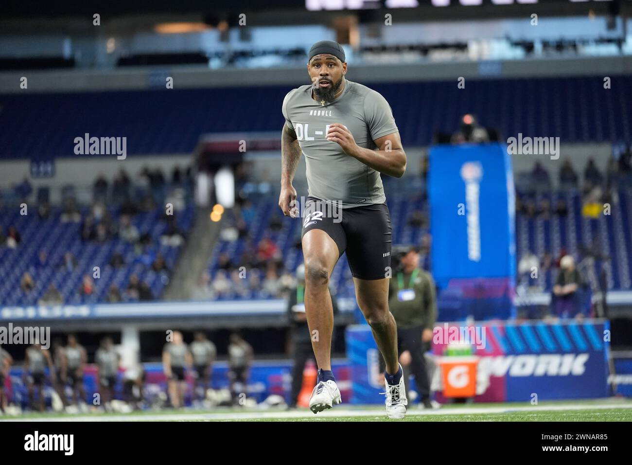 Connecticut defensive lineman Eric Watts runs a drill at the NFL ...