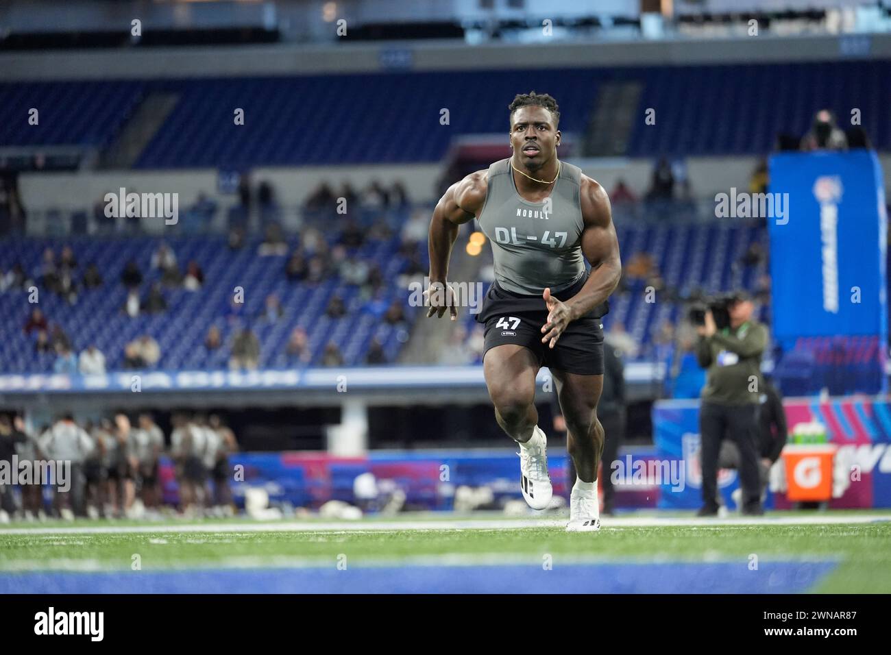 Troy defensive lineman Javon Solomon runs a drill at the NFL football ...