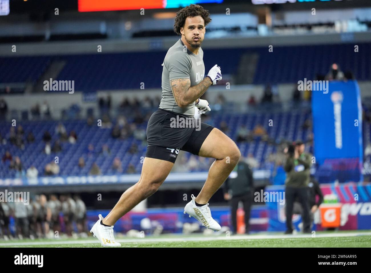 Washington defensive lineman Bralen Trice runs a drill at the NFL ...