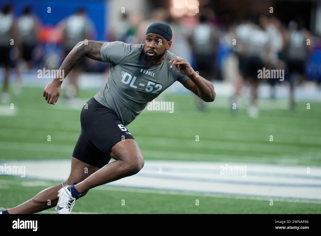 Connecticut defensive lineman Eric Watts runs a drill at the NFL ...