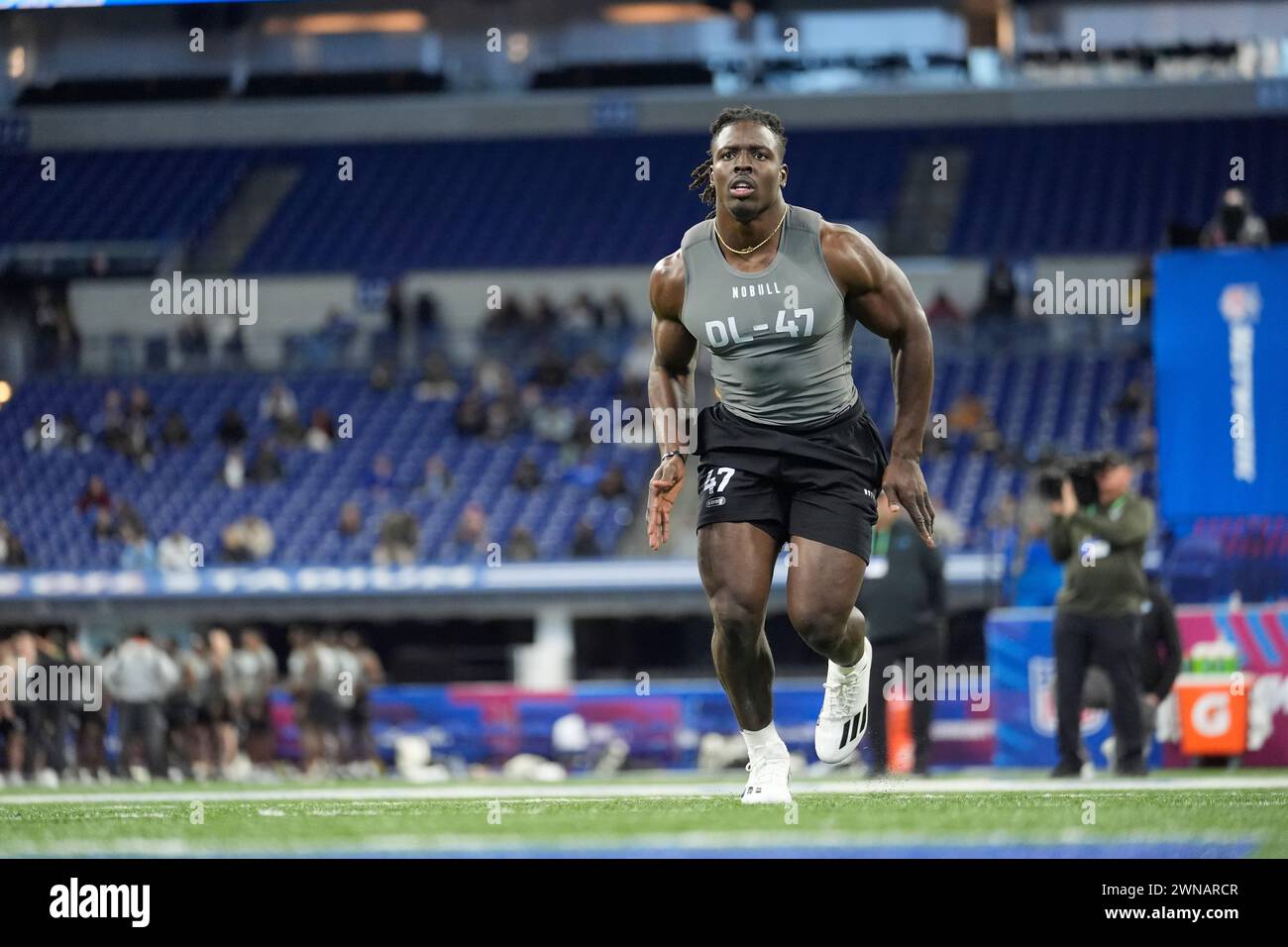 Troy defensive lineman Javon Solomon runs a drill at the NFL football ...