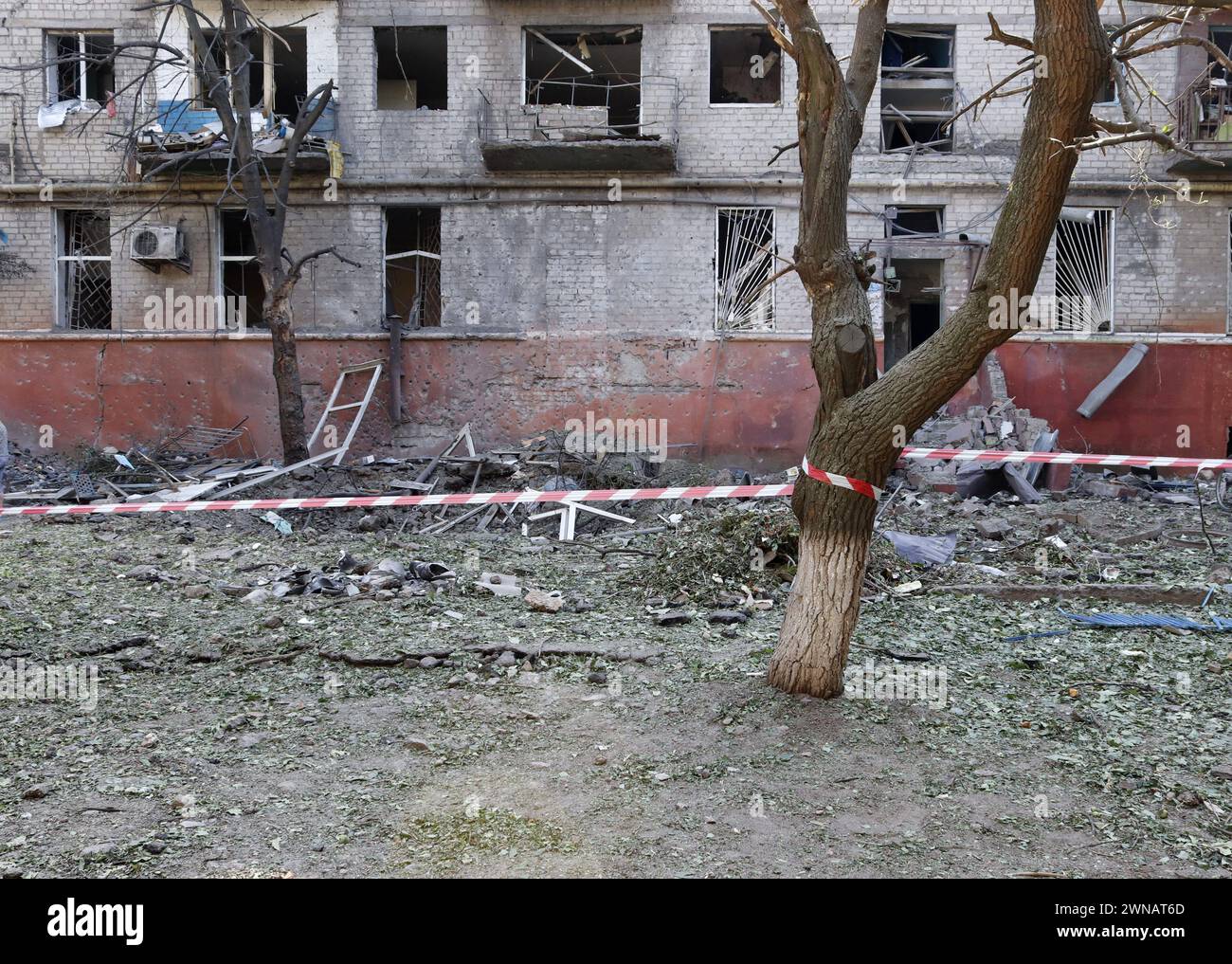 Destroyed apartment building after rocket attack. Traces of fragments ...