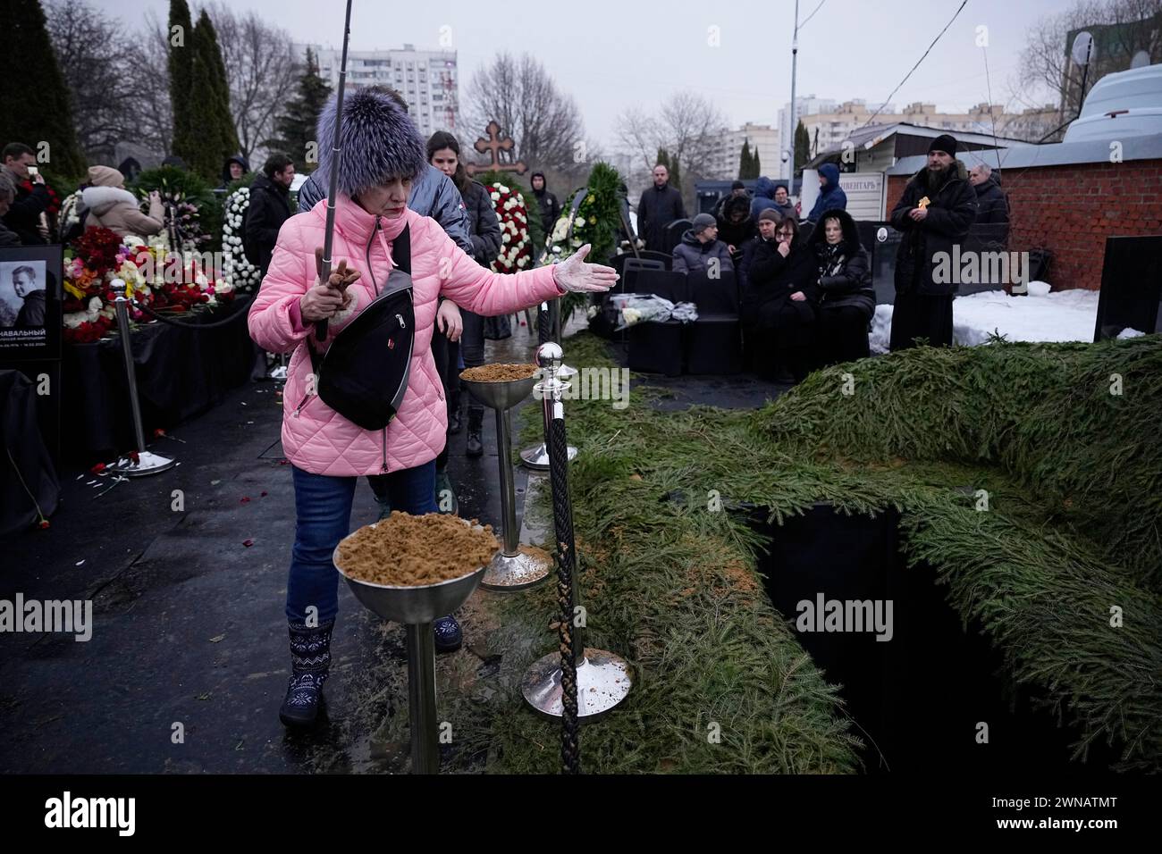 People attend the funeral ceremony at the Borisovskoye Cemetery, in ...