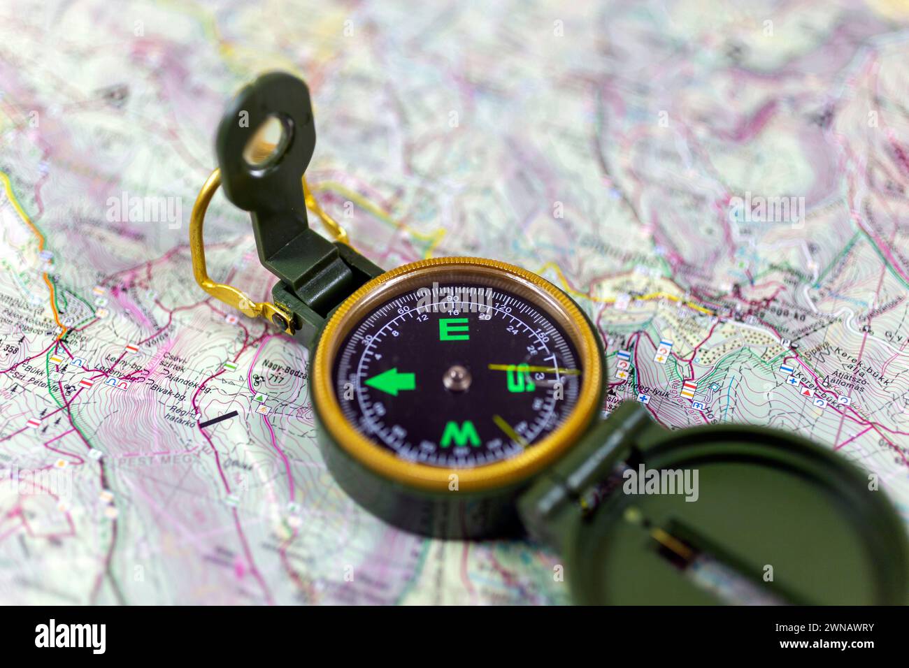 Analog compass on a paper map Stock Photo - Alamy