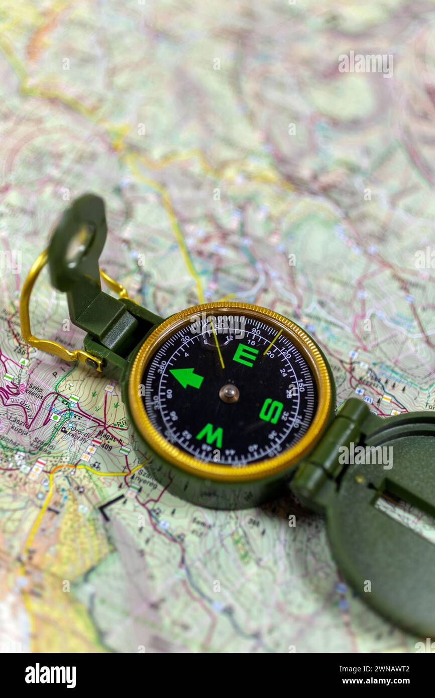 Analog compass on a paper map Stock Photo - Alamy