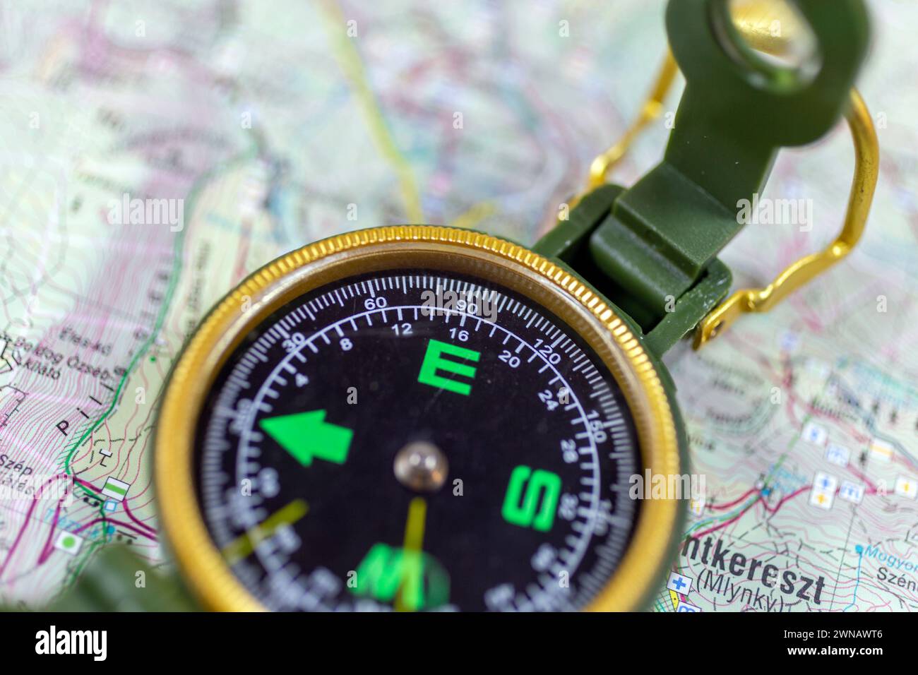 Analog compass on a paper map Stock Photo - Alamy