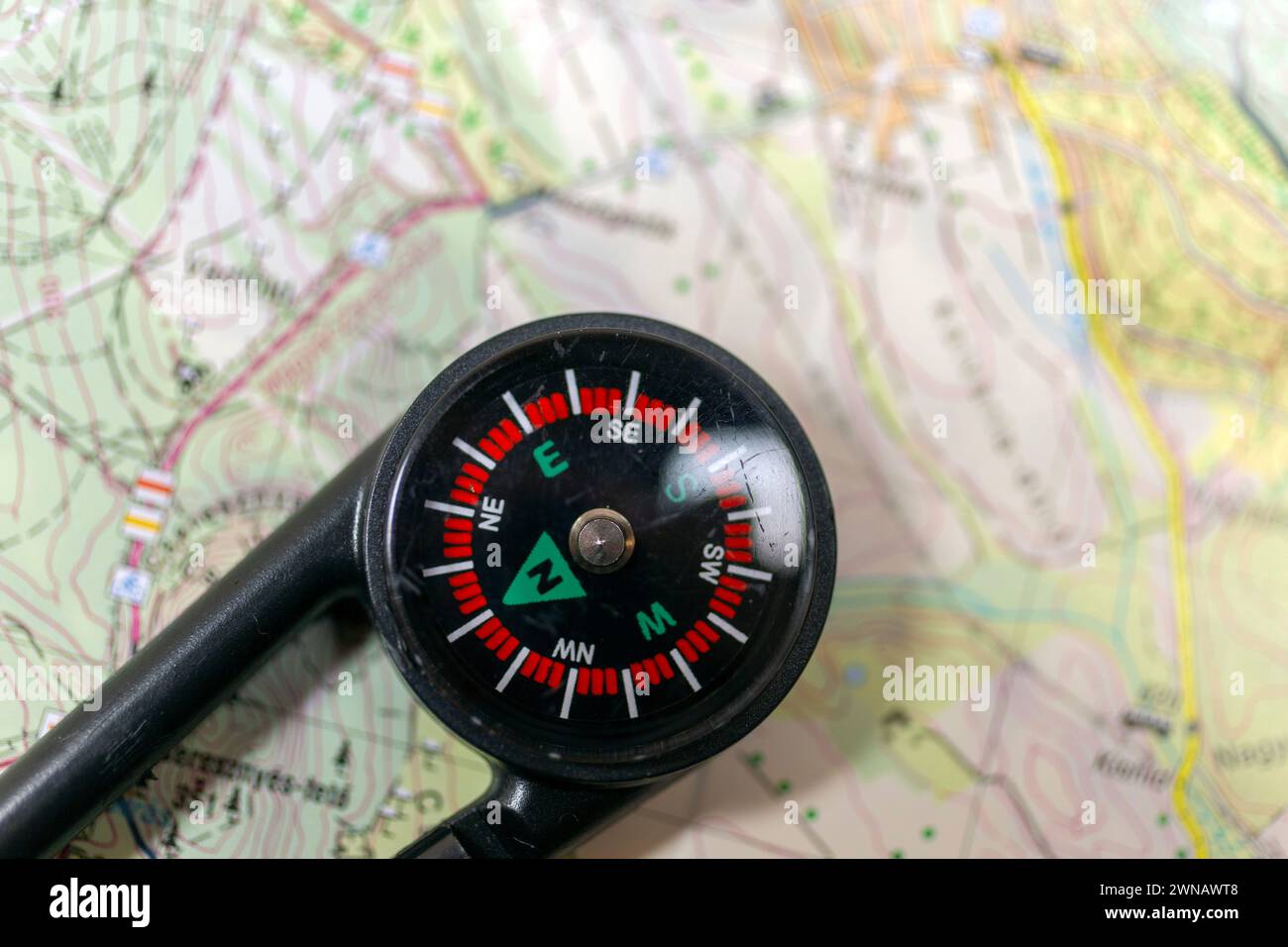 Analog compass on a paper map Stock Photo - Alamy
