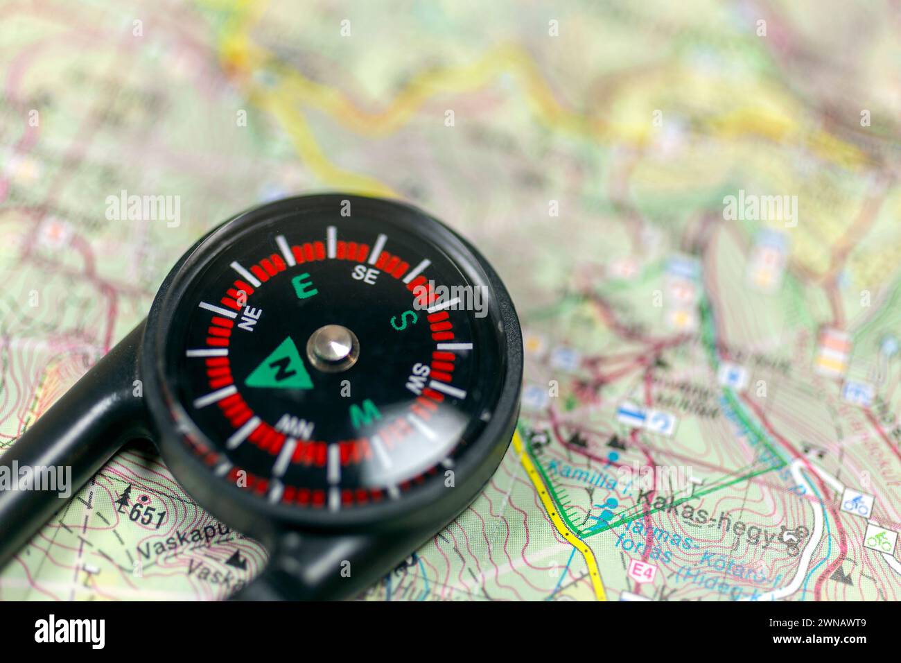 Analog compass on a paper map Stock Photo - Alamy
