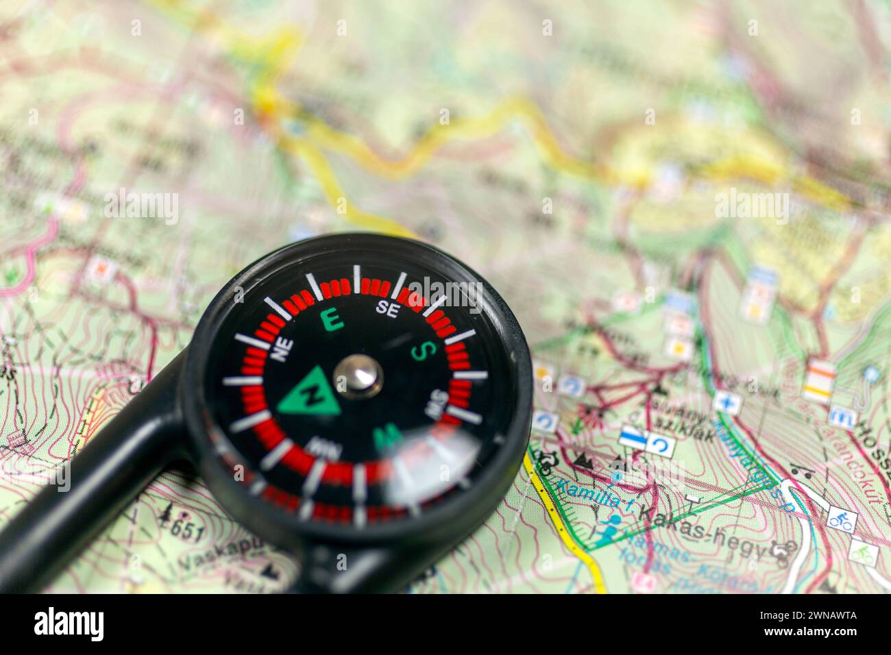 Analog compass on a paper map Stock Photo - Alamy