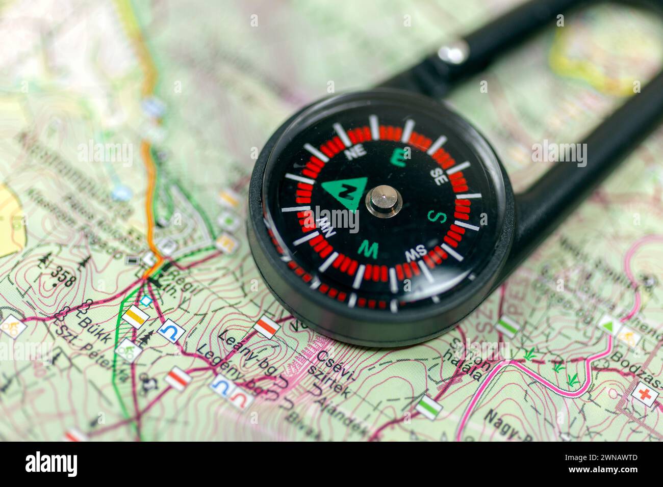 Analog compass on a paper map Stock Photo - Alamy