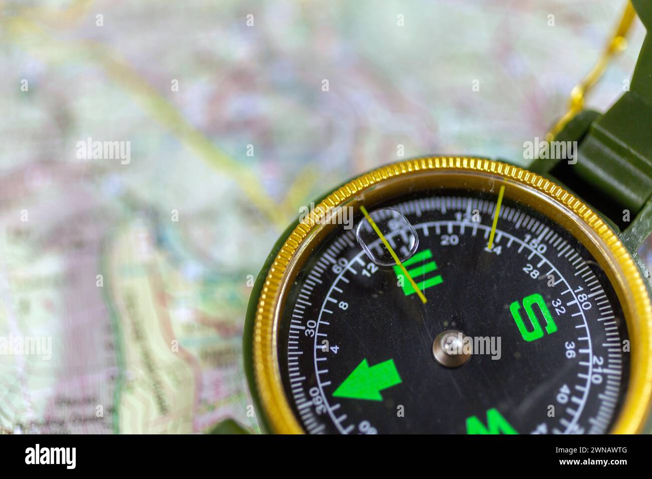 Analog compass on a paper map Stock Photo - Alamy