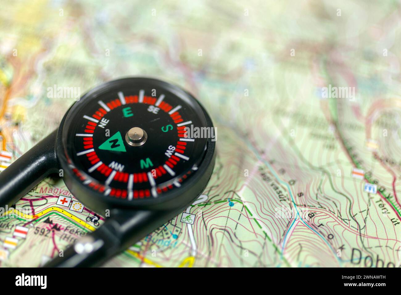 Analog compass on a paper map Stock Photo - Alamy