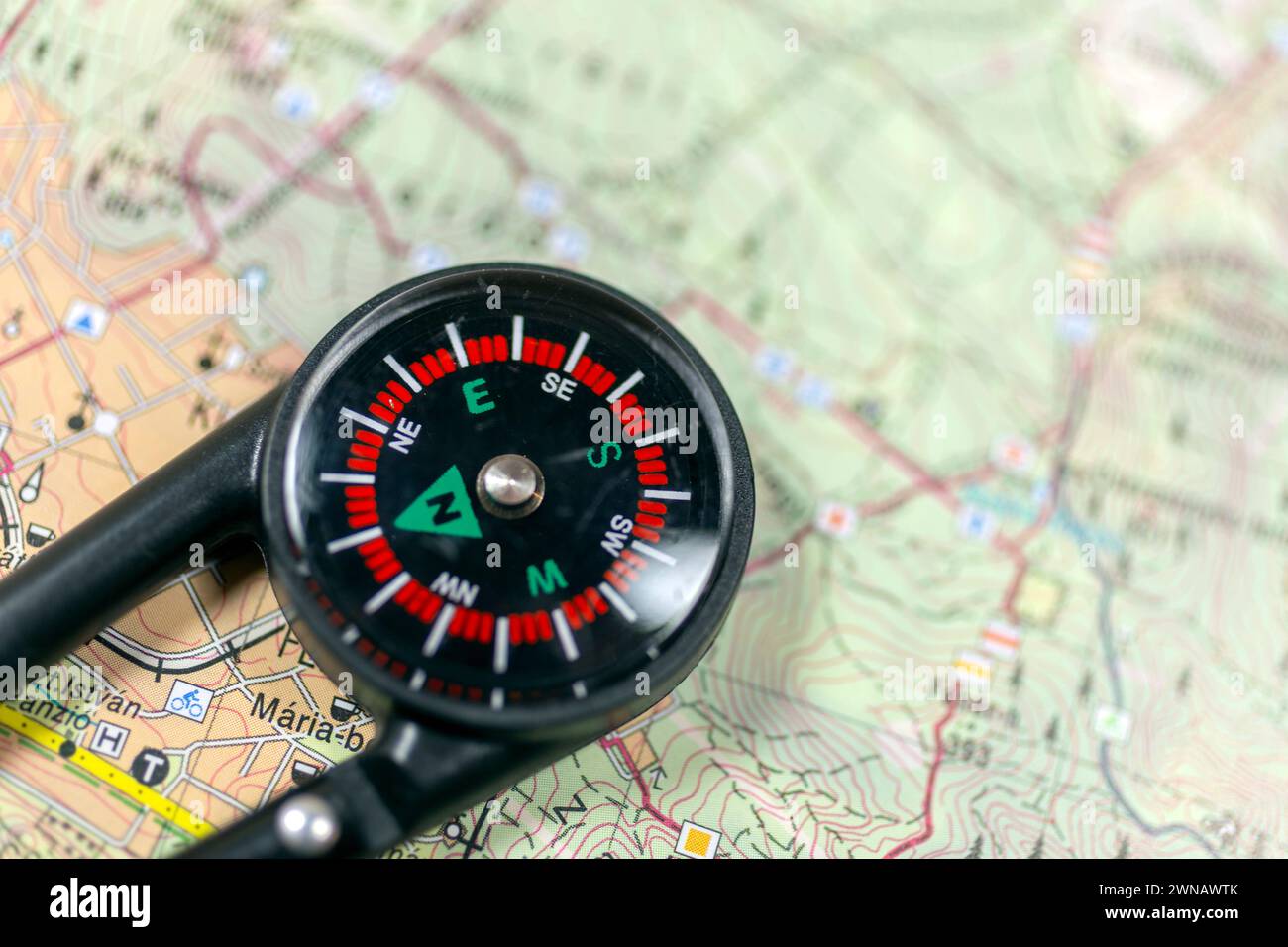 Analog compass on a paper map Stock Photo - Alamy