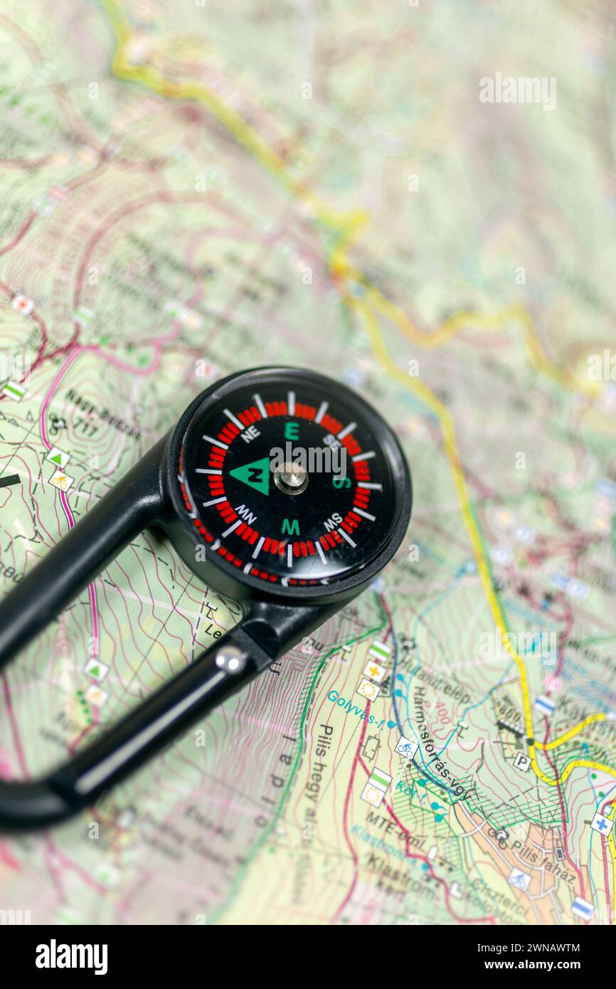 Analog compass on a paper map Stock Photo - Alamy