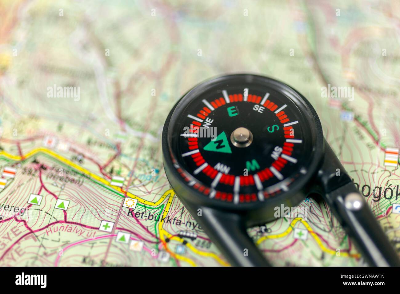 Analog compass on a paper map Stock Photo - Alamy