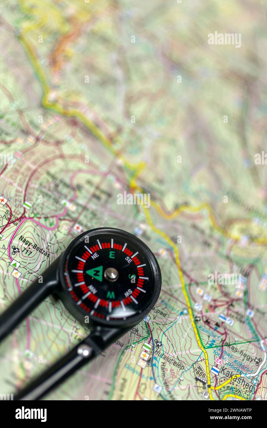 Analog compass on a paper map Stock Photo - Alamy