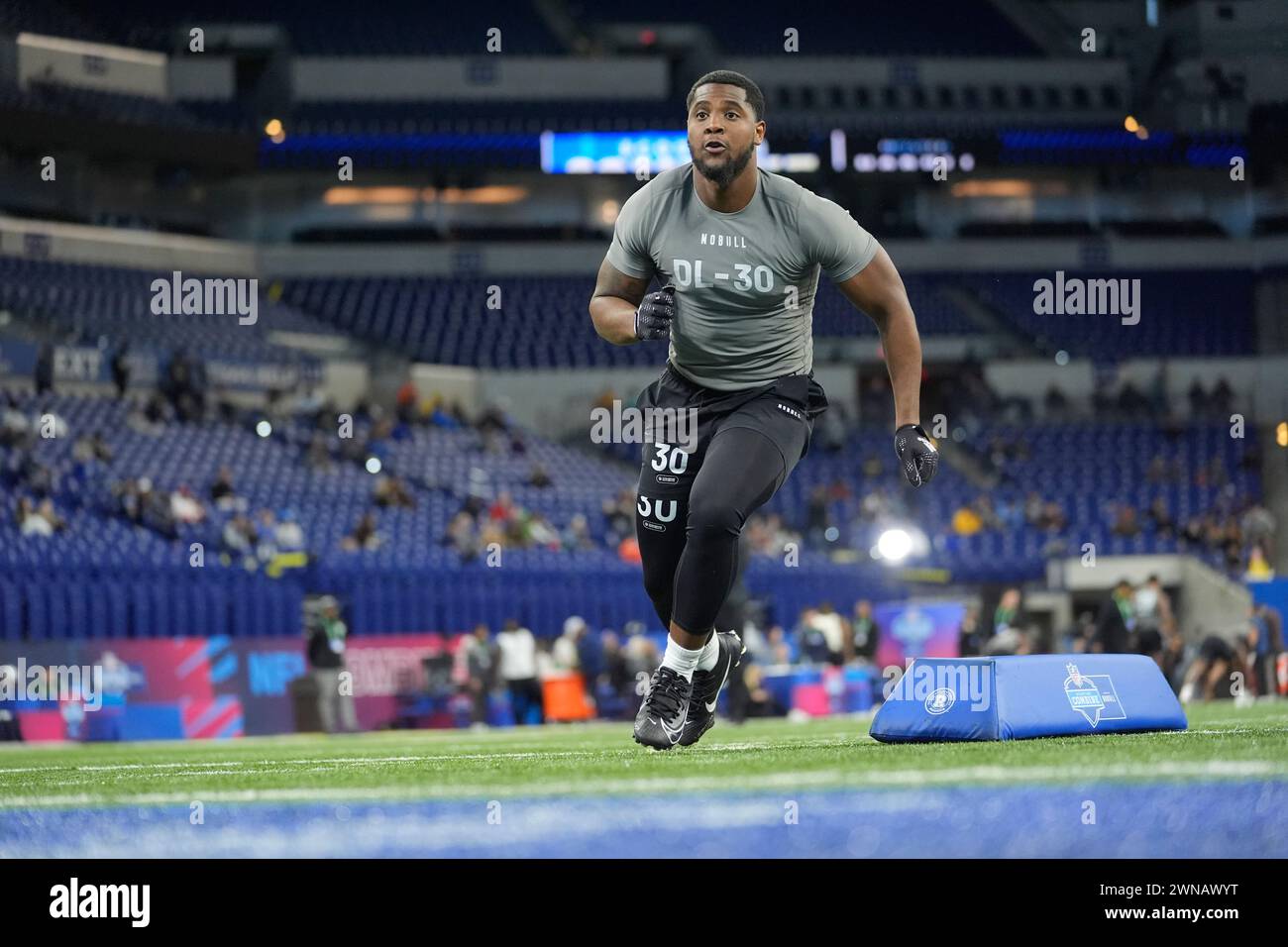 Houston defensive lineman Nelson Ceaser runs a drill at the NFL ...