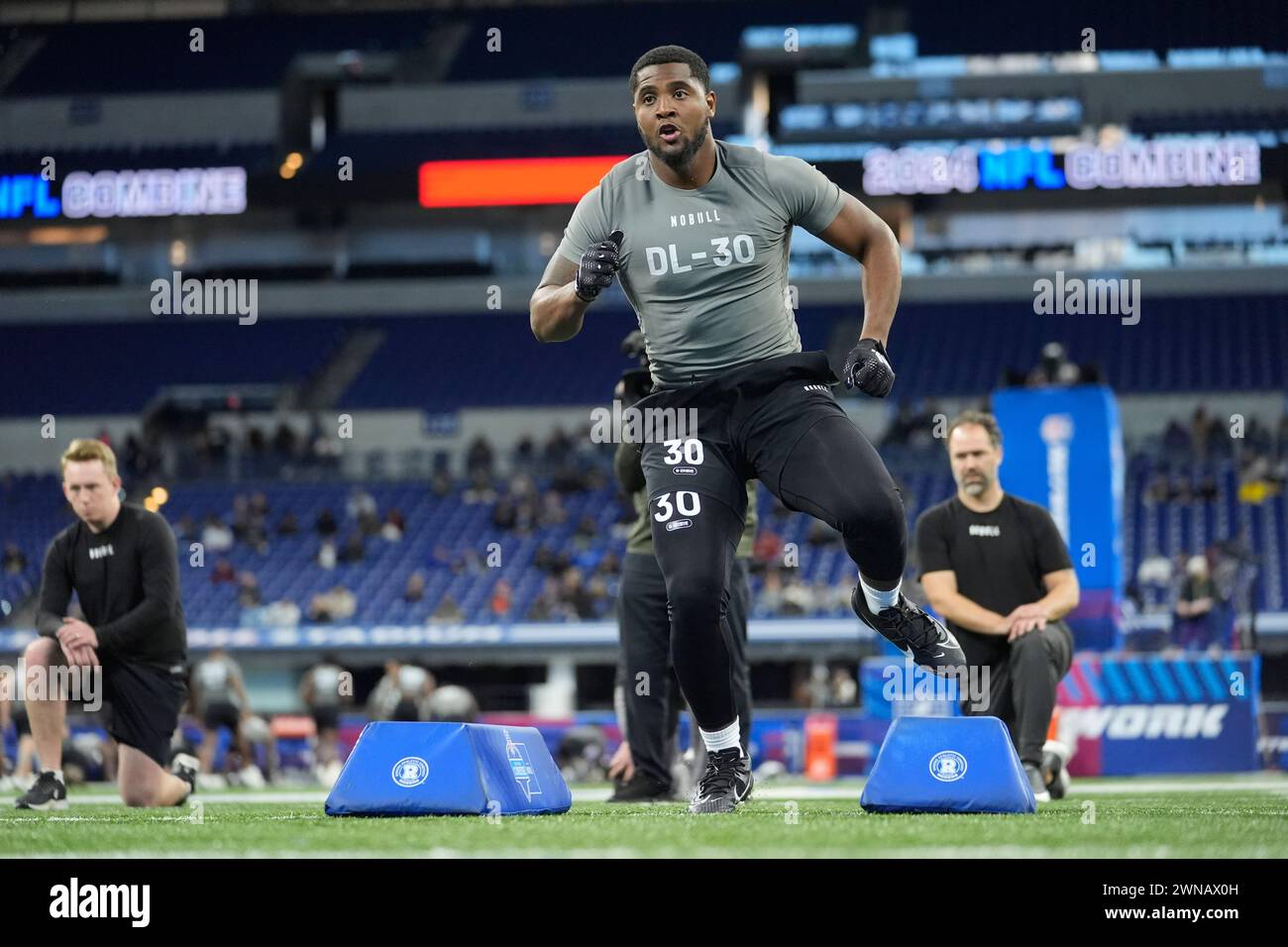 Houston defensive lineman Nelson Ceaser runs a drill at the NFL ...