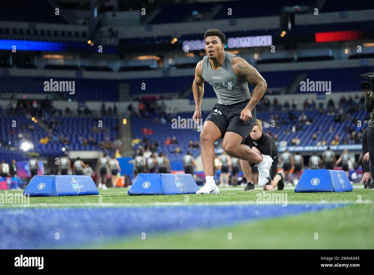 Penn State defensive lineman Chop Robinson runs a drill at the NFL ...