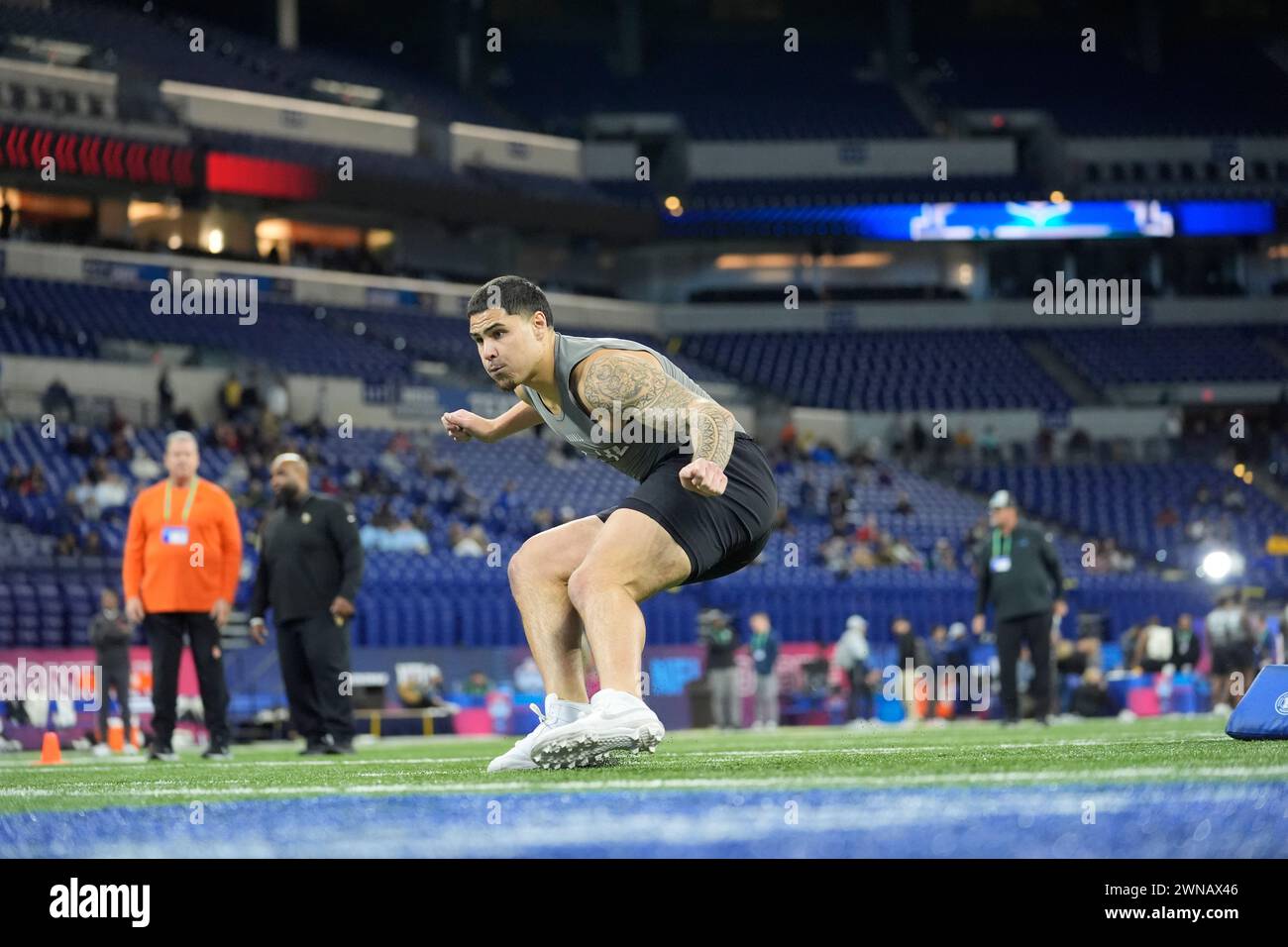UCLA defensive lineman Laiatu Latu runs a drill at the NFL football ...