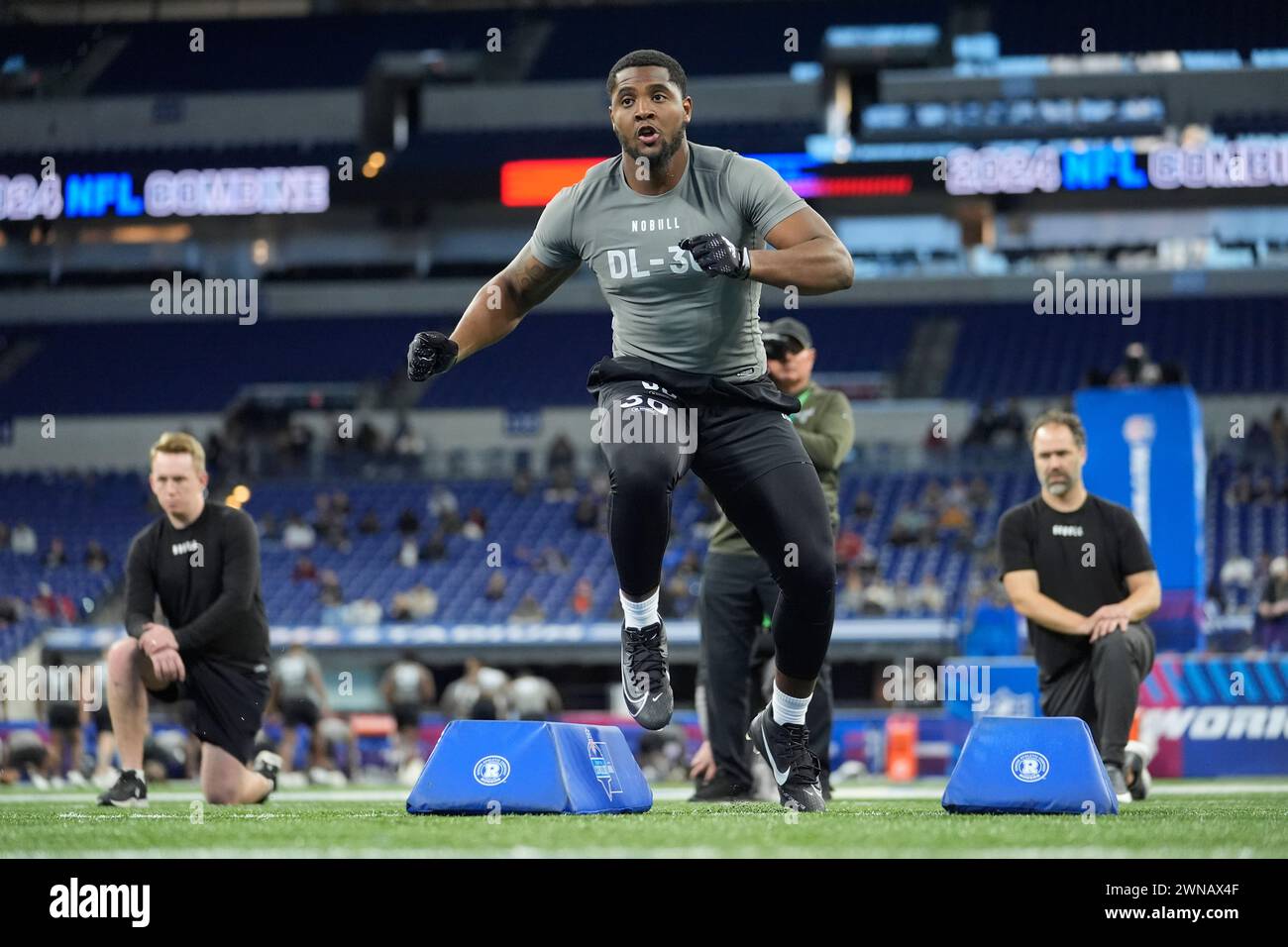 Houston defensive lineman Nelson Ceaser runs a drill at the NFL ...