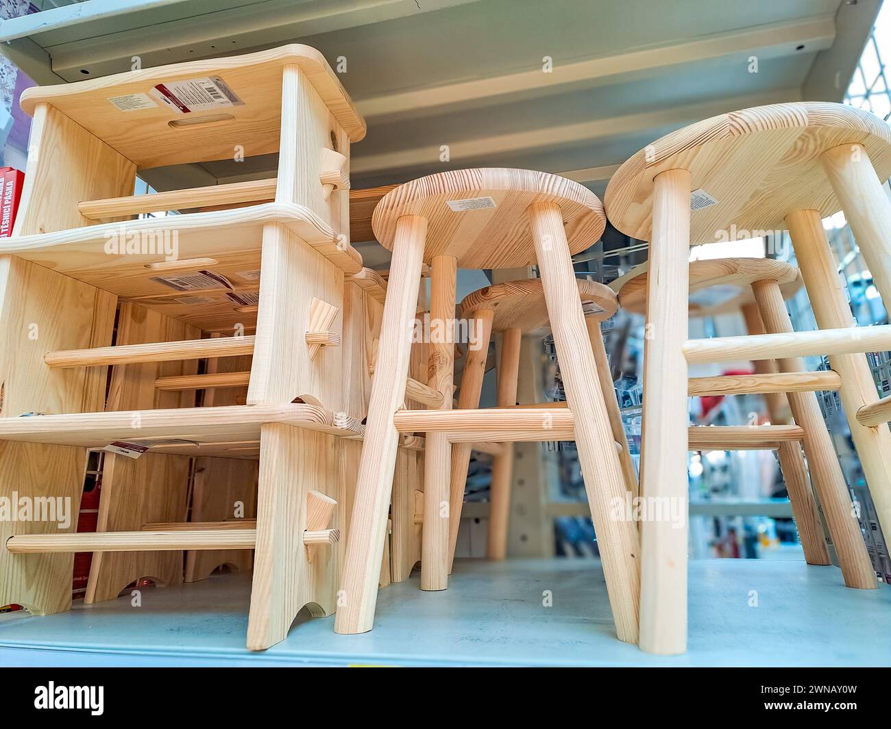 Handmade wooden stools on a shelf in a store Stock Photo - Alamy