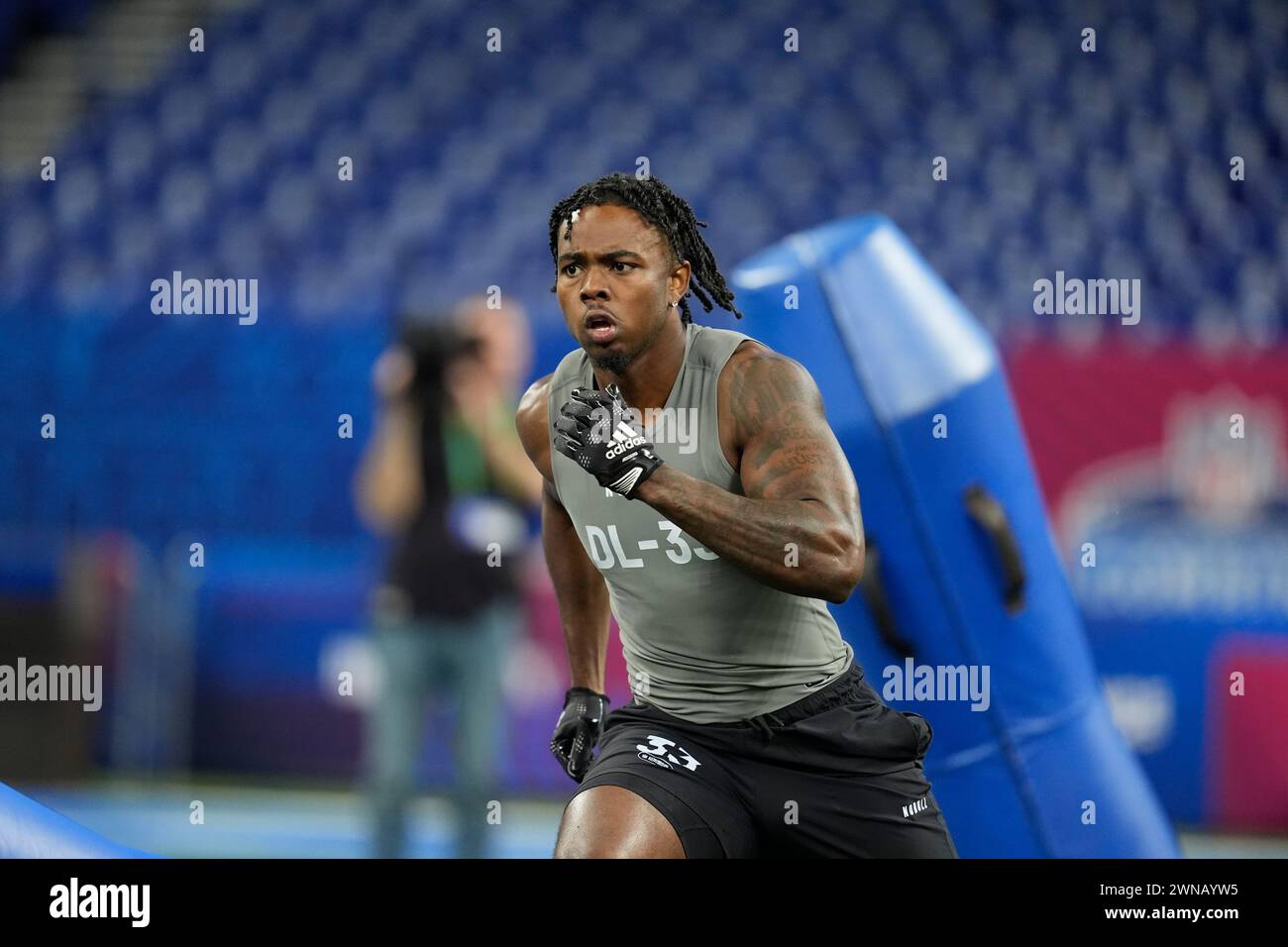 Michigan defensive lineman Jaylen Harrell runs a drill at the NFL ...
