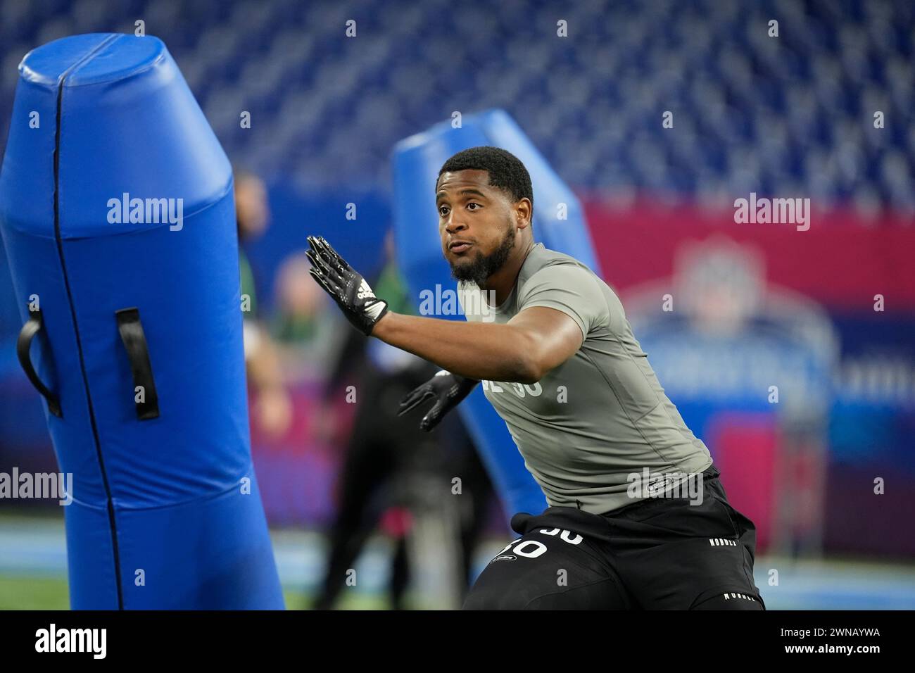 Houston defensive lineman Nelson Ceaser runs a drill at the NFL ...
