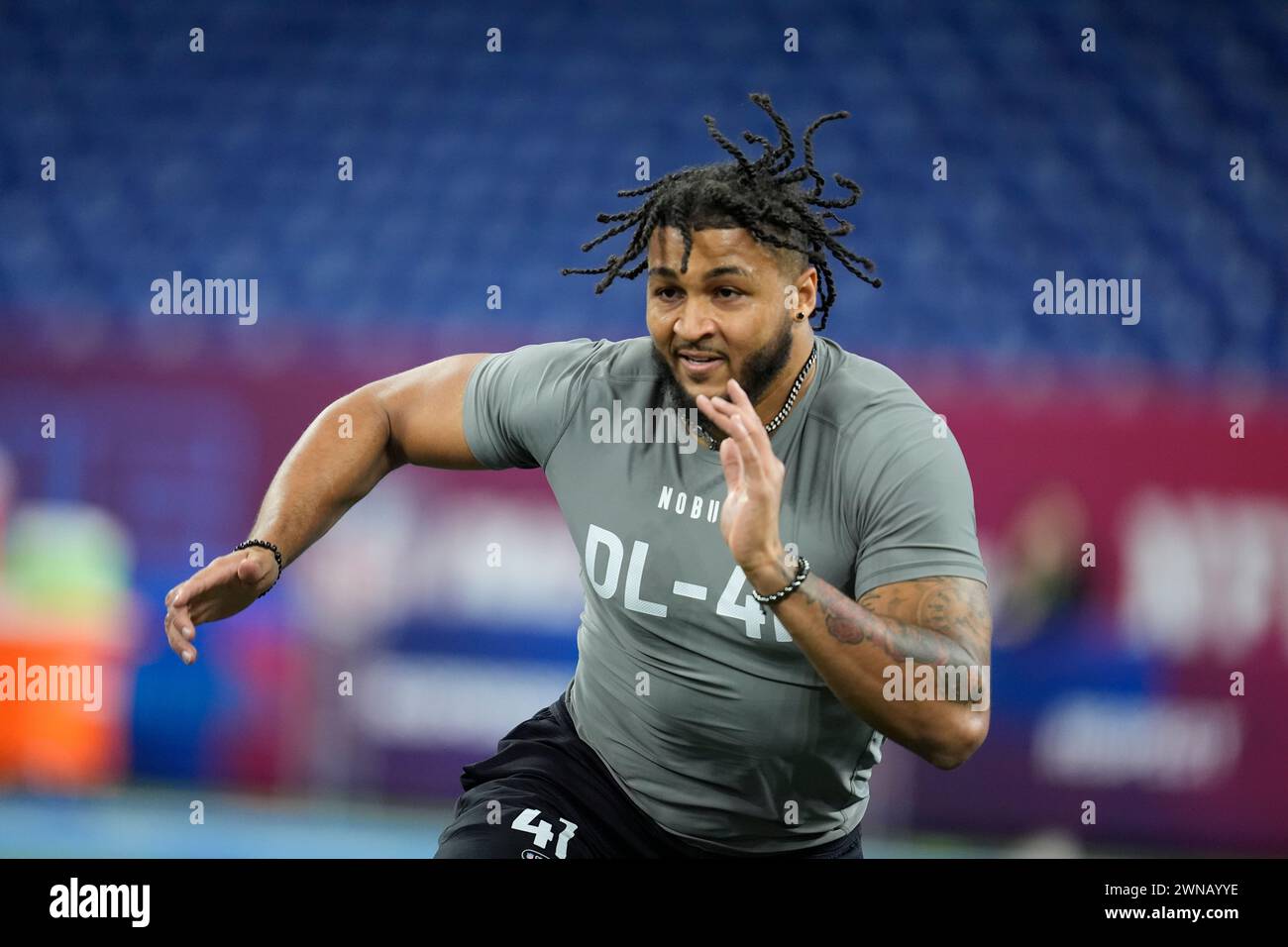 Western Michigan defensive lineman Marshawn Kneeland runs a drill at ...