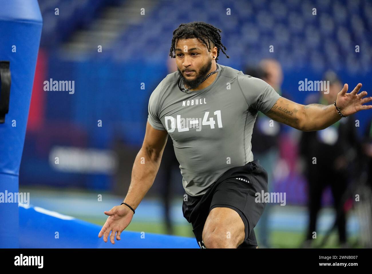 Western Michigan defensive lineman Marshawn Kneeland runs a drill at ...