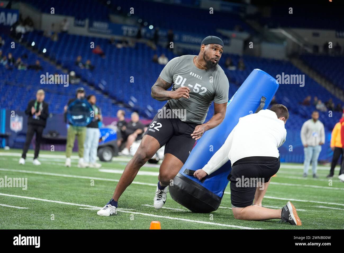 Connecticut defensive lineman Eric Watts runs a drill at the NFL ...