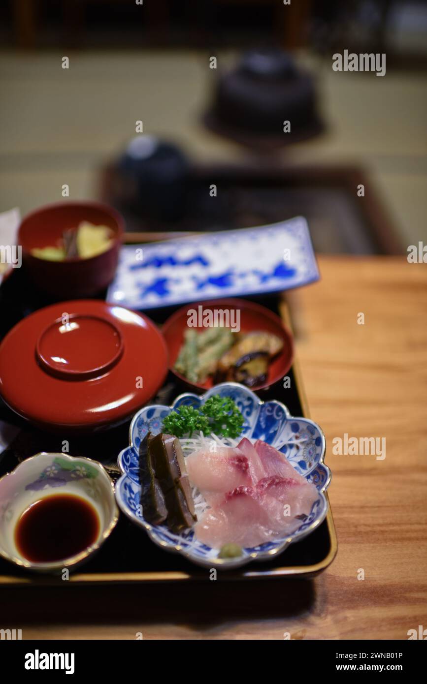 Dinner tray with assorted traditional Japanese food in Gassho Minshuku ...