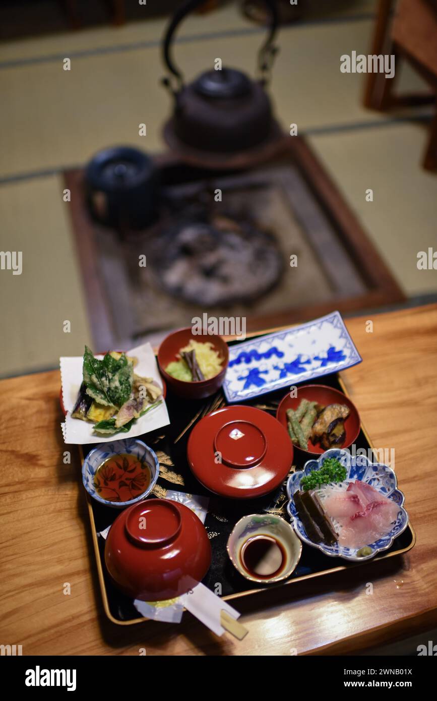 Dinner tray with assorted traditional Japanese food in Gassho Minshuku ...