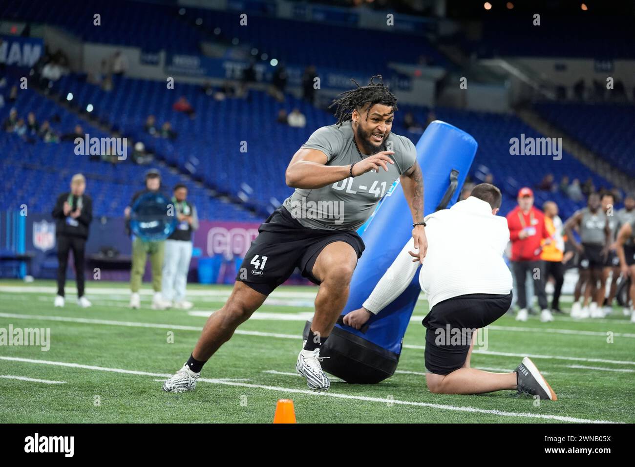 Western Michigan defensive lineman Marshawn Kneeland runs a drill at ...