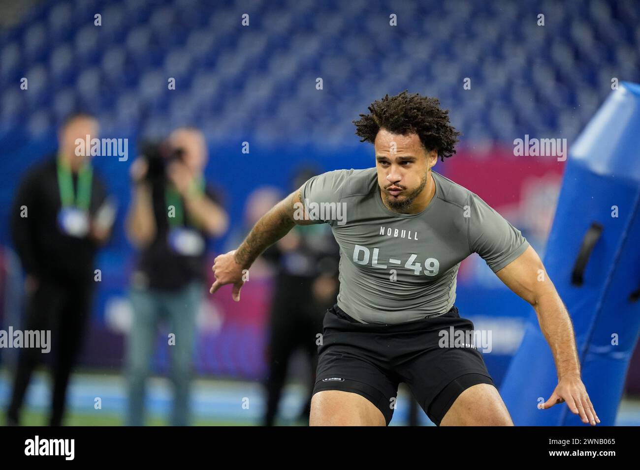 Washington defensive lineman Bralen Trice runs a drill at the NFL ...