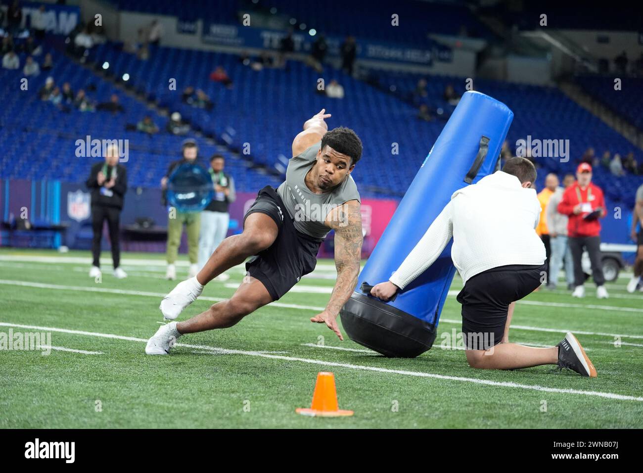 Penn State defensive lineman Chop Robinson runs a drill at the NFL ...