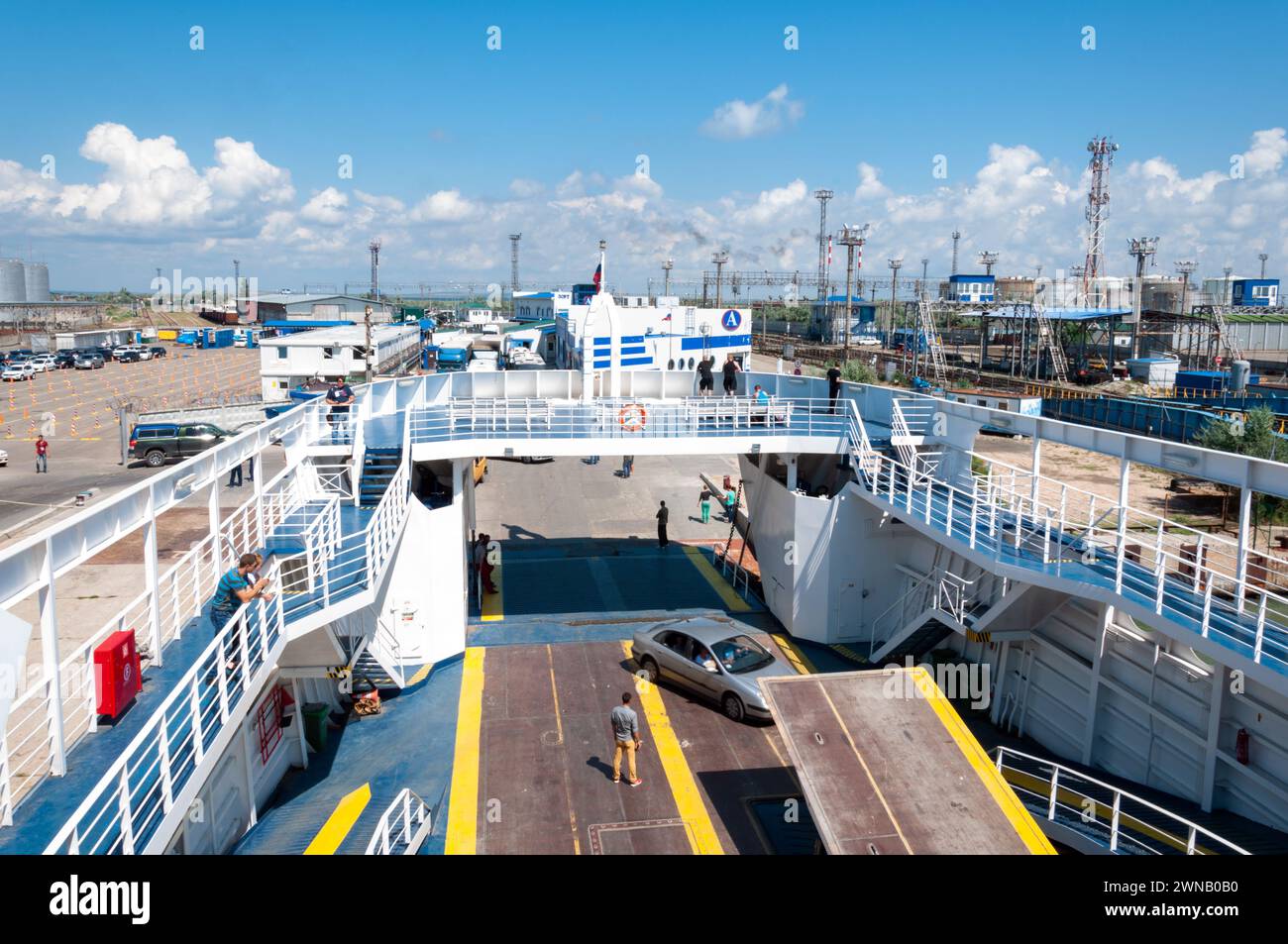 June 27, 2015 Russia Port Kavkaz. Loading cars onto a ferry on a summer ...
