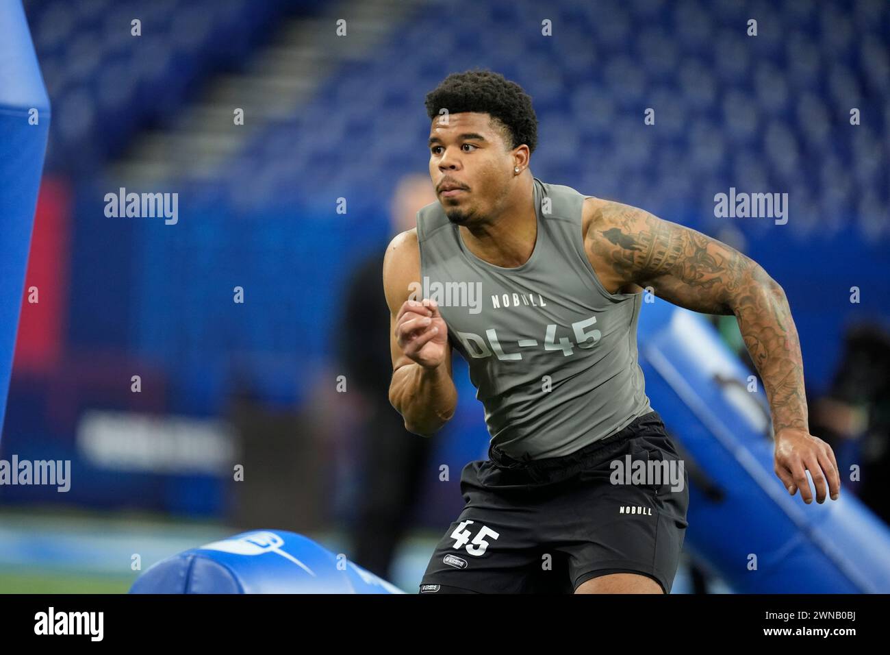 Penn State defensive lineman Chop Robinson runs a drill at the NFL ...