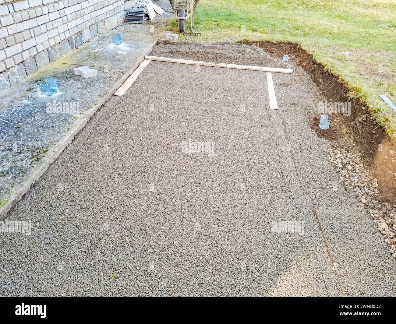 Laying gray concrete paving slabs in house courtyard driveway ...
