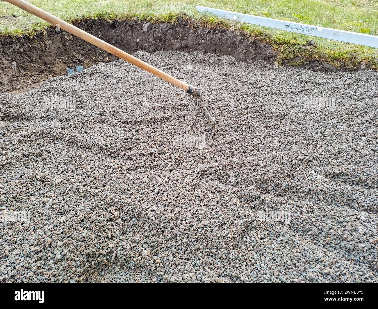 Laying gray concrete paving slabs in house courtyard driveway ...